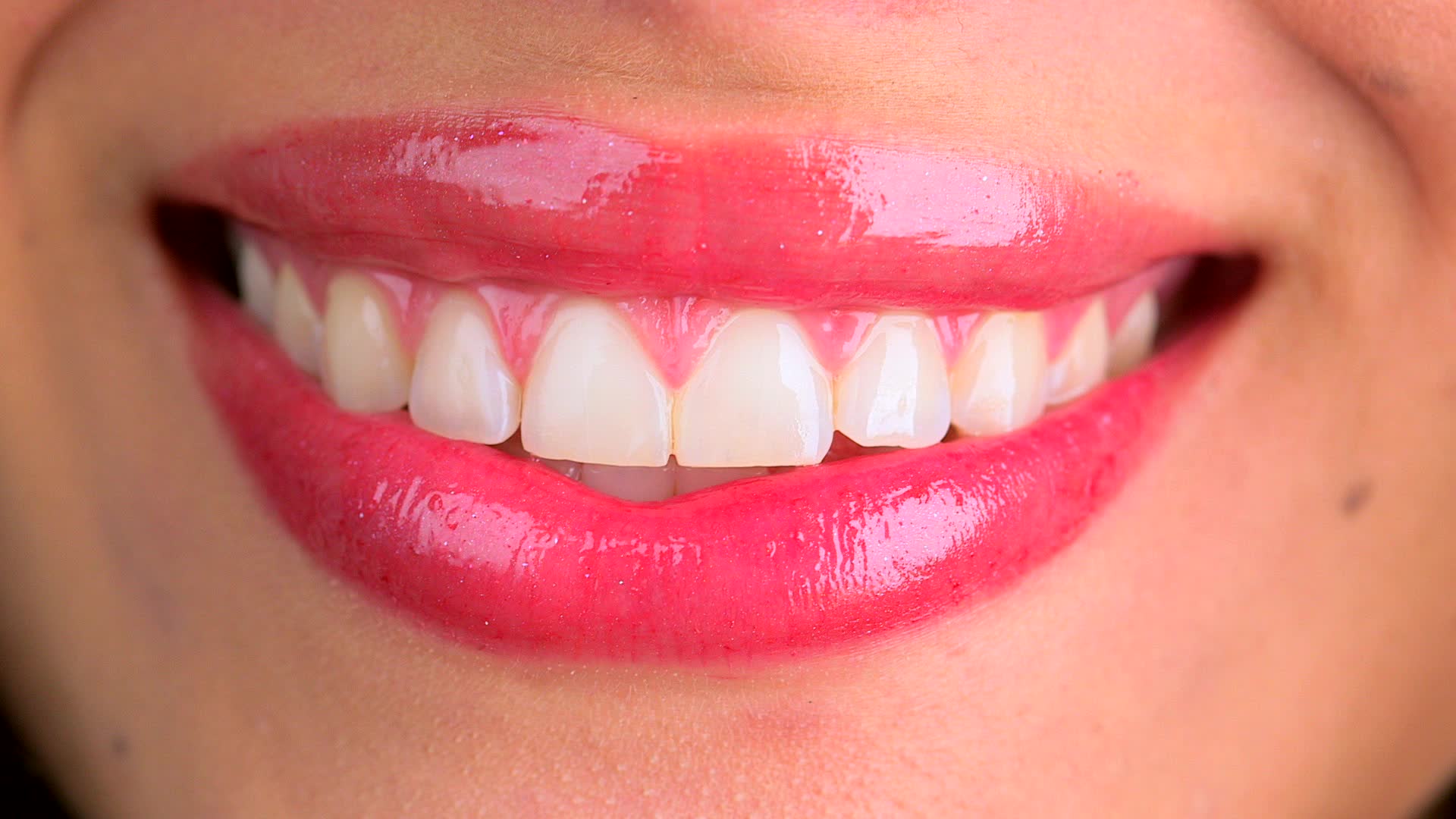 Extreme close up of smiling lips ~ Hi Res Video #22793951
